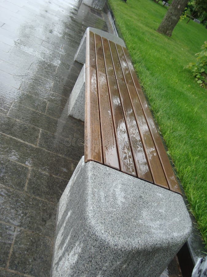 Drenched rain-water bench stock image. Image of track - 220596871