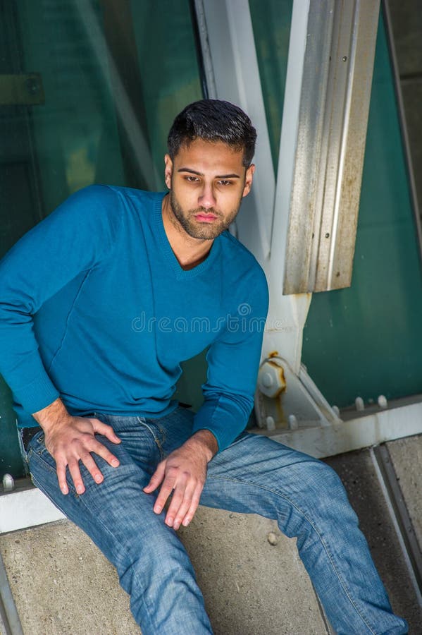 Portrait of Young Man Sitting Outdoors, Relaxing, Thinking Stock Photo ...