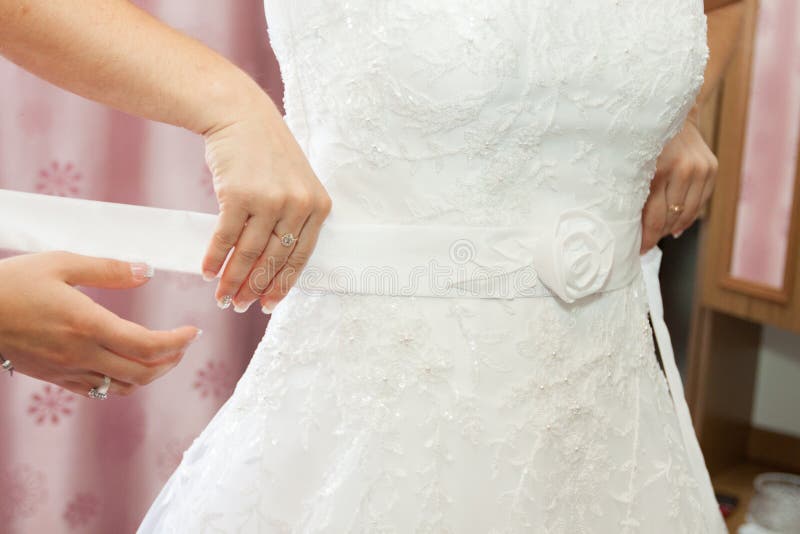 Dressing the bride dresses stock photo. Image of dressing - 36498506