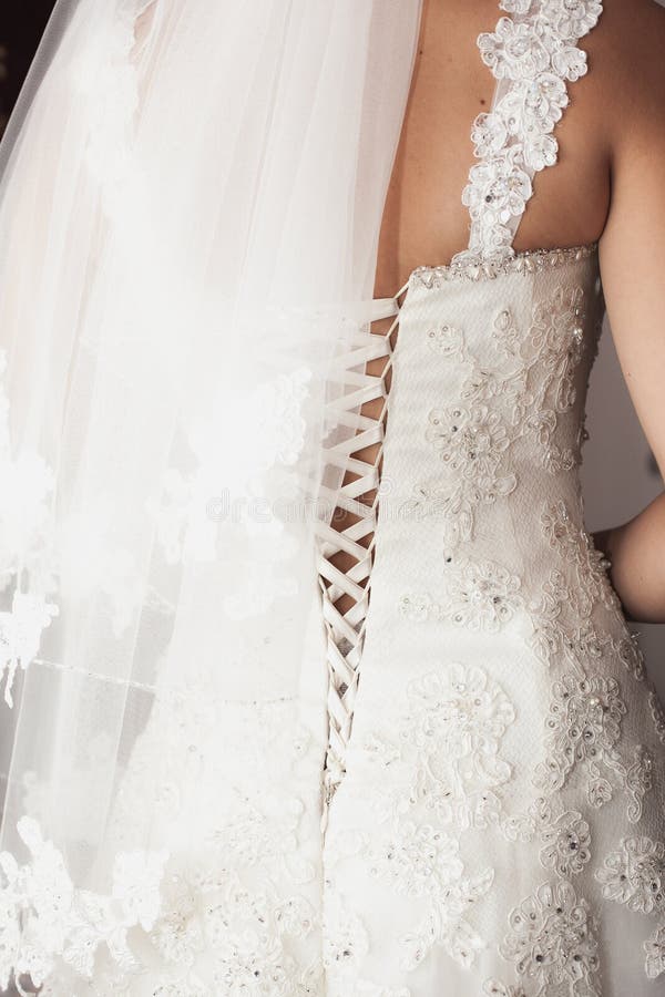 Dressing the bride dresses stock photo. Image of designer - 42338650