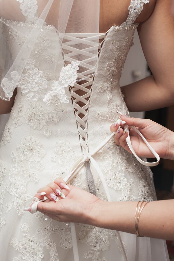 Dressing the bride dresses stock image. Image of fashion - 42338651