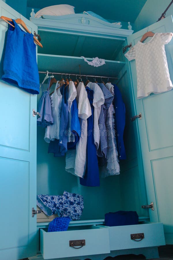 Dressing Closet with Blue Clothes in the Closet Stock Photo - Image of ...
