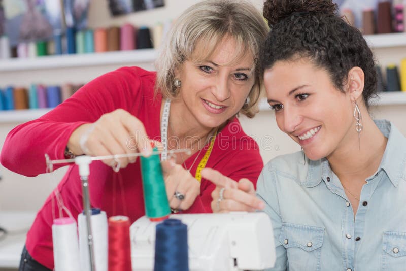 Dressmaker Couple Working with Sewing Machine Stock Image - Image of ...