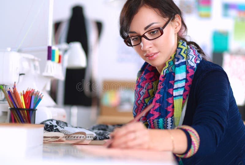 Dressmaker Designing Clothes Pattern on Paper Stock Photo - Image of ...