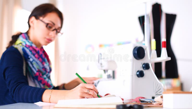 Dressmaker Designing Clothes Pattern on Paper Stock Photo - Image of ...