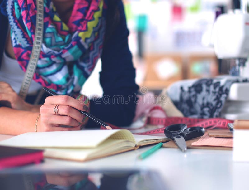 Dressmaker Designing Clothes Pattern on Paper Stock Photo - Image of ...