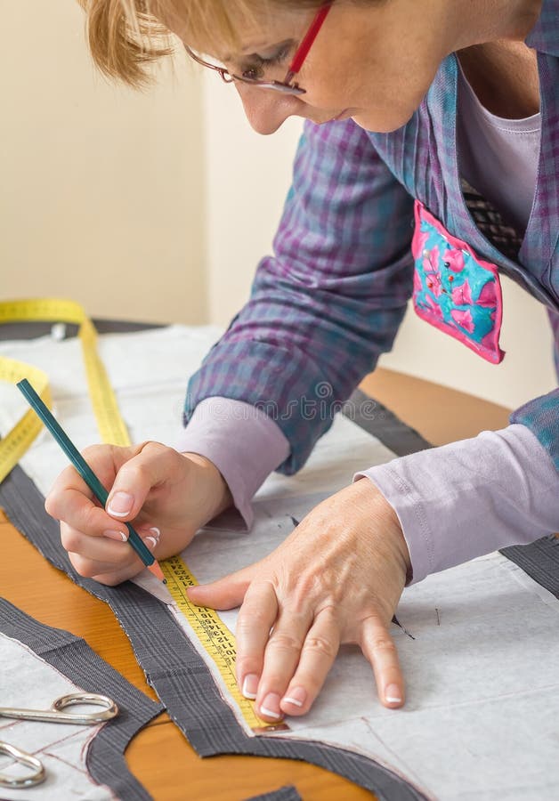 Dressmaker Drawing Tailor Pattern on the Table Stock Photo - Image of ...
