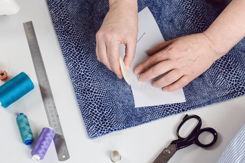Dressmaker Marks a Piece of Clothing on a Fabric with a Chalk According ...