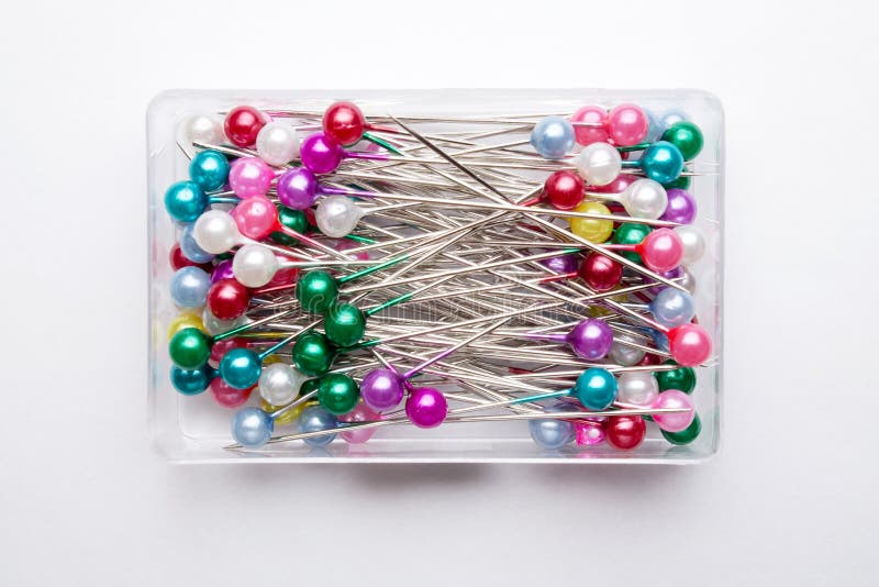 Dressmaker Pins with a Spool of Thread and a Thimble on the Mate Stock ...