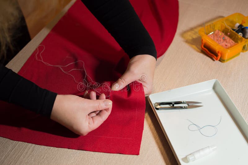 Dressmaker`s Hands Sewing Red Fabric Stock Image - Image of fabric ...