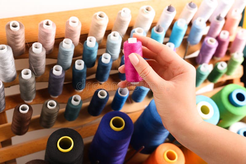 Dressmaker Taking Pink Thread from Stand, Closeup Stock Photo - Image ...