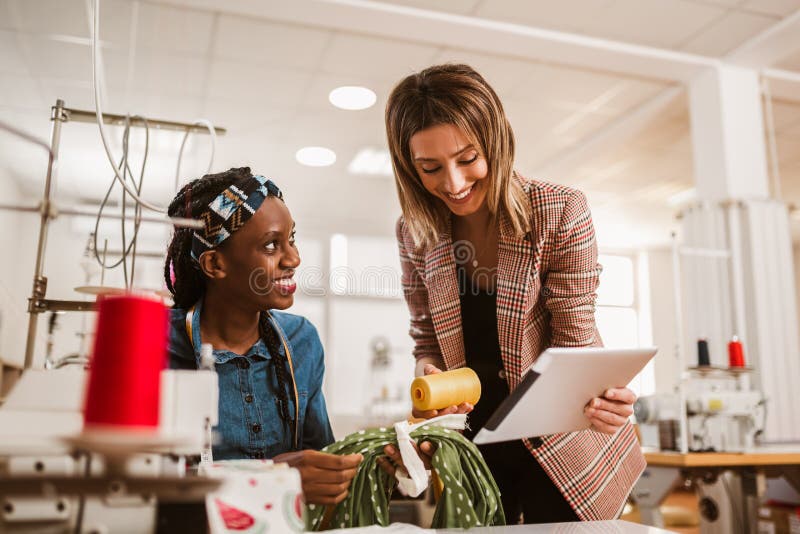 Woman Working with Sewing Machine, Using Digital Tablet Stock Photo ...
