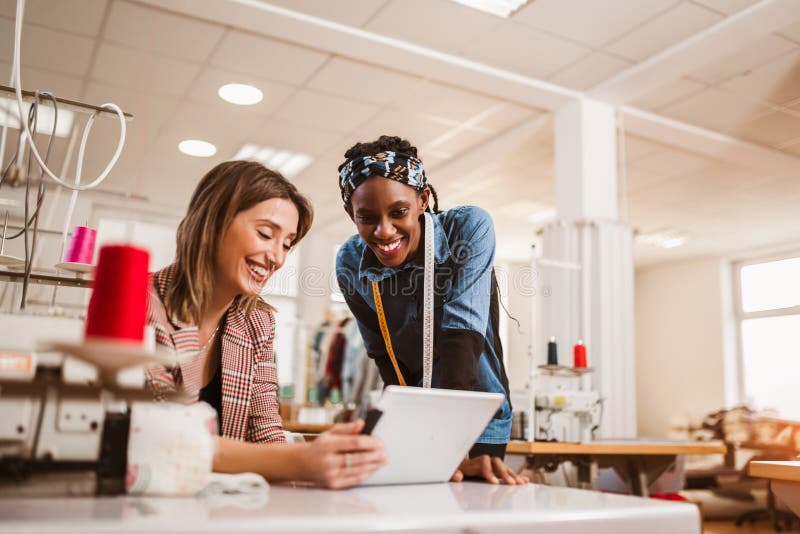 Woman Working with Sewing Machine, Using Digital Tablet Stock Image ...