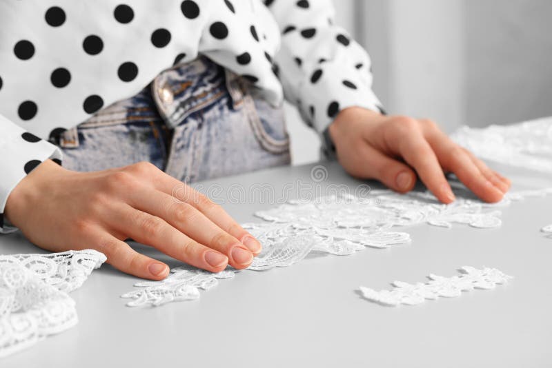Dressmaker Working with Beautiful White Lace at Table in Atelier ...