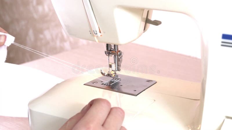 The Dressmaker Works on a Sewing Machine. Finish Stitching the Fabric ...