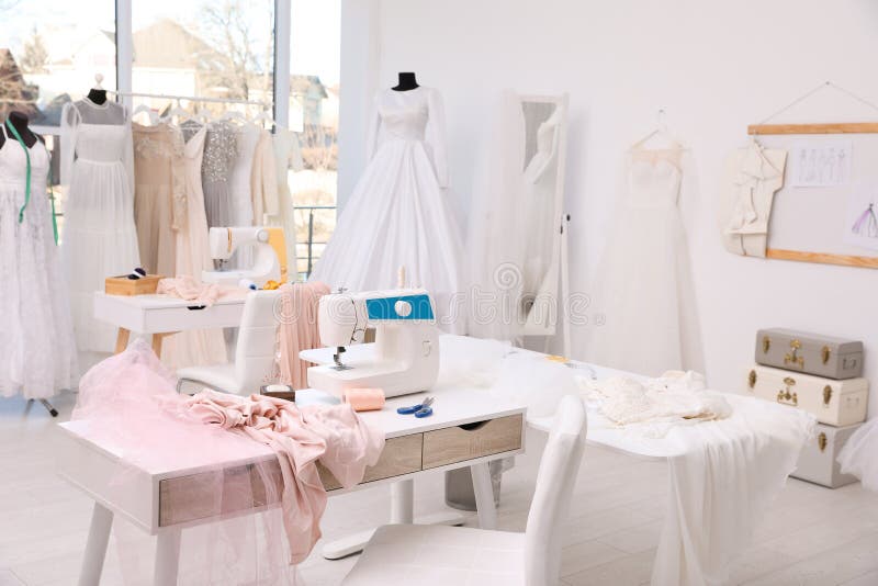 Dressmaking Workshop Interior with Wedding Dresses and Equipment Stock ...