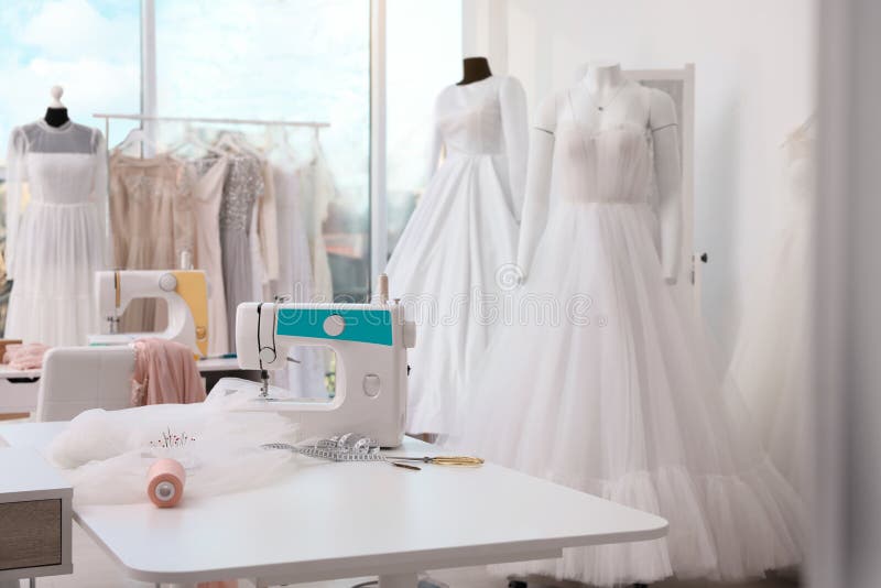 Dressmaking Workshop Interior with Wedding Dresses and Equipment Stock ...