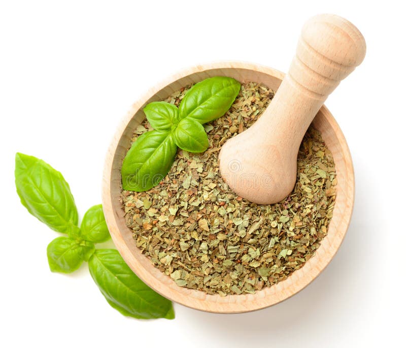 Dried Basil in the Wooden Mortar, Isolated on White, Top View Stock ...