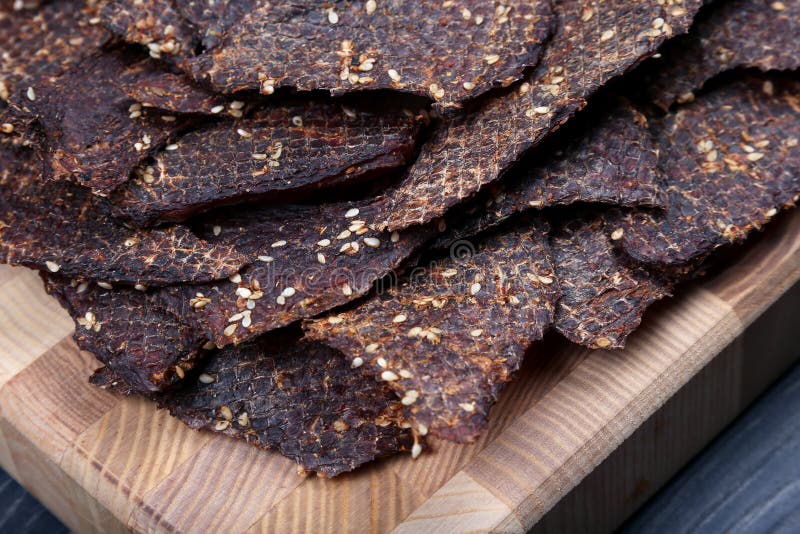 Dried Beef Slices in Spices with Sesame Seeds Stock Photo - Image of ...
