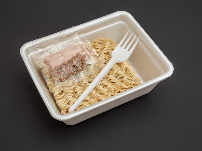 Dried Block of Instant Noodle with Seasoning Sachets and Plastic Fork ...