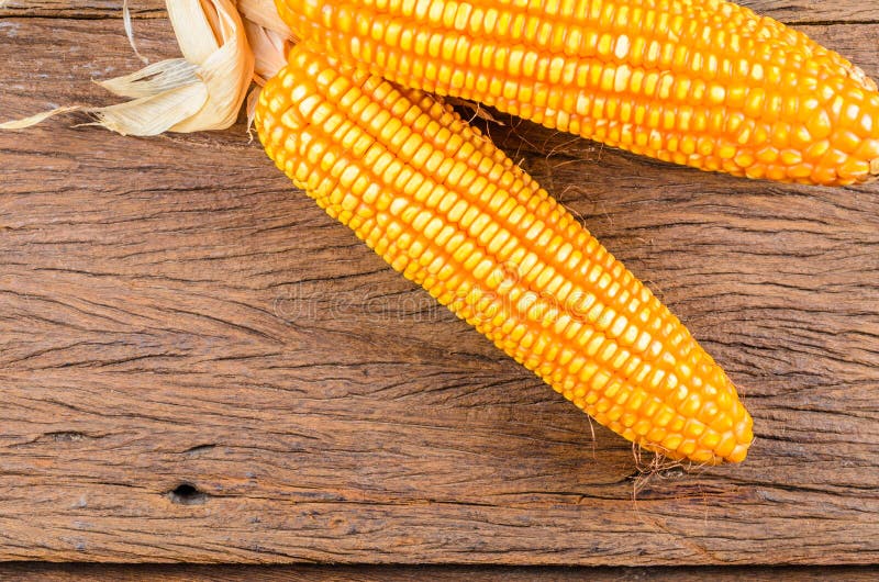 Dried corn on wooden table stock photo. Image of leaf - 78142064