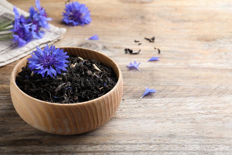 Dried Cornflower Tea and Fresh Flowers on Wooden Table. Space for Text ...
