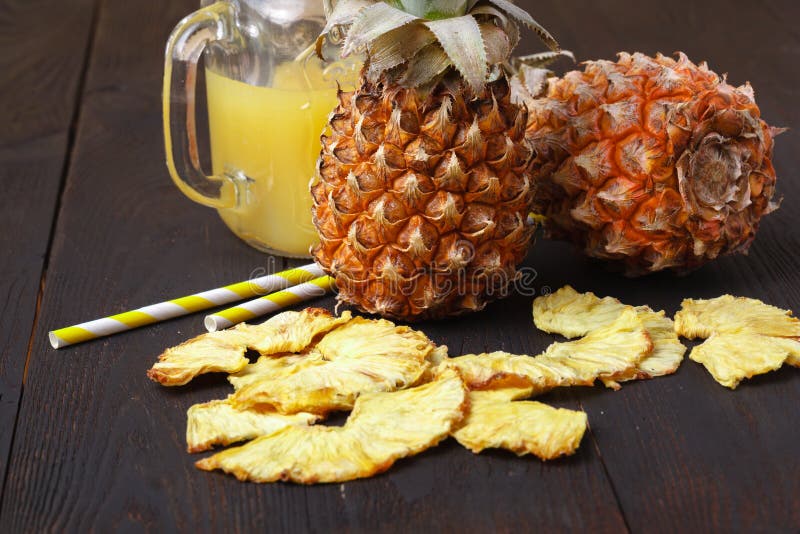 Dried Dehydrated Deep Fried Pineapple Chips in a Wooden Table Stock ...