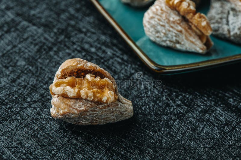 A Dried Fig Filled with Half Walnut on a Table Stock Photo - Image of ...