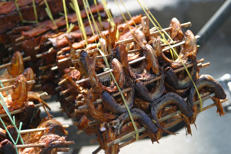 Dried Fish with Lemon and Rosemary Lying on a Stone Tile Stock Photo ...