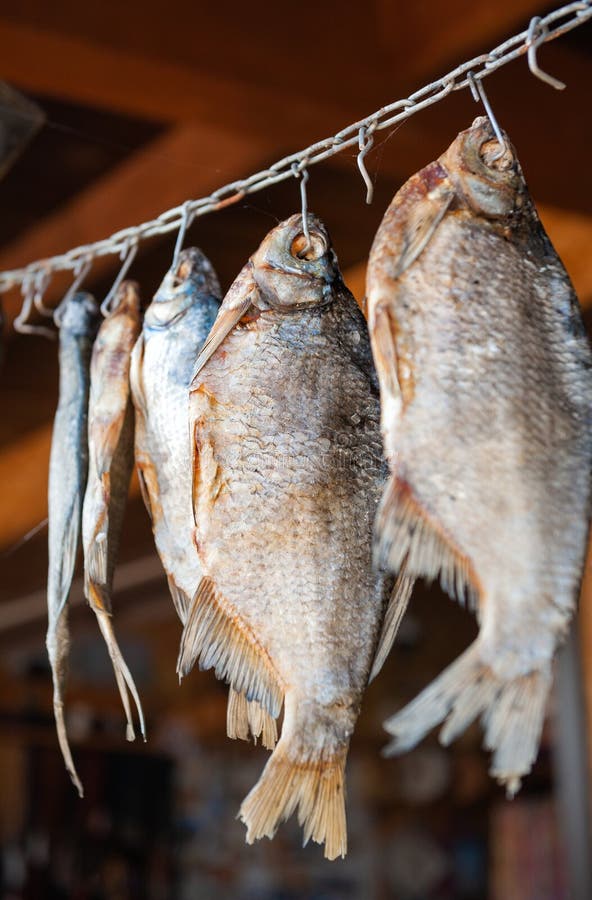 Dried Fish Hanging on Hooks, Perfect for Rustic Food Content Stock Image - Image of traditional ...