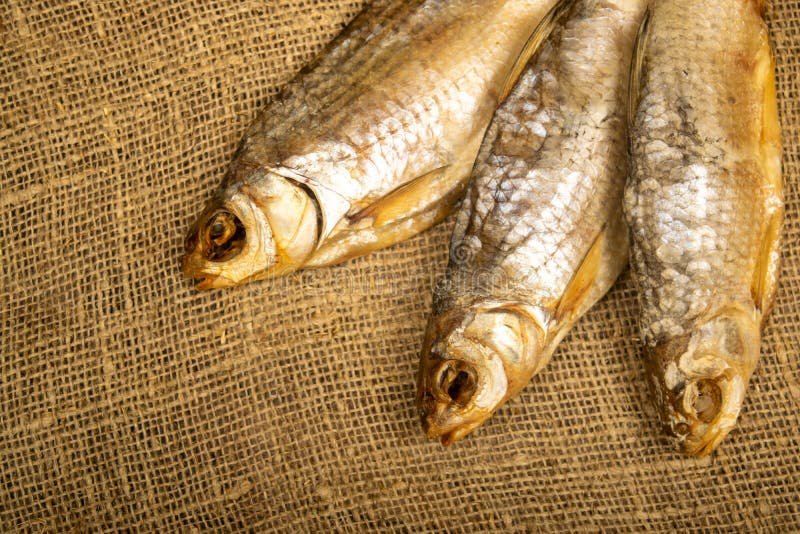 Dried Fish on a Homespun Fabric with a Rough Texture. Close Up Stock ...