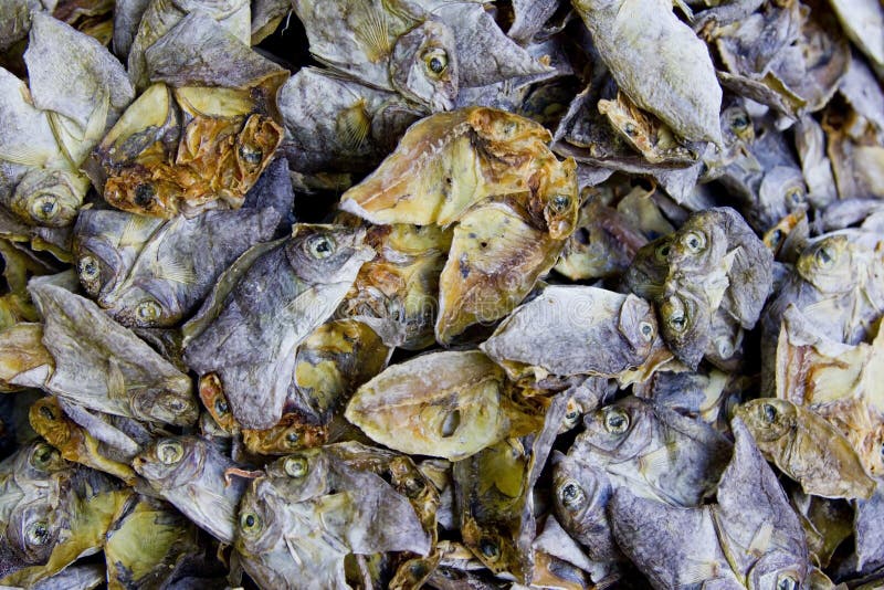 Dried Fish with Lemon and Rosemary Lying on a Stone Tile Stock Photo ...