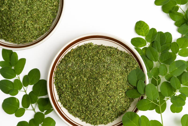 Fresh Moringa Leaves Moringa Oleifera on Yellow Background on Top with ...