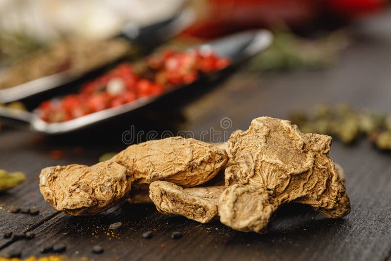 Dried Ginger on Dark Wooden Table Close Up Stock Photo - Image of ...