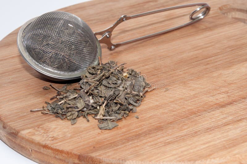 Green tea in tea strainer stock photo. Image of herb - 53322782