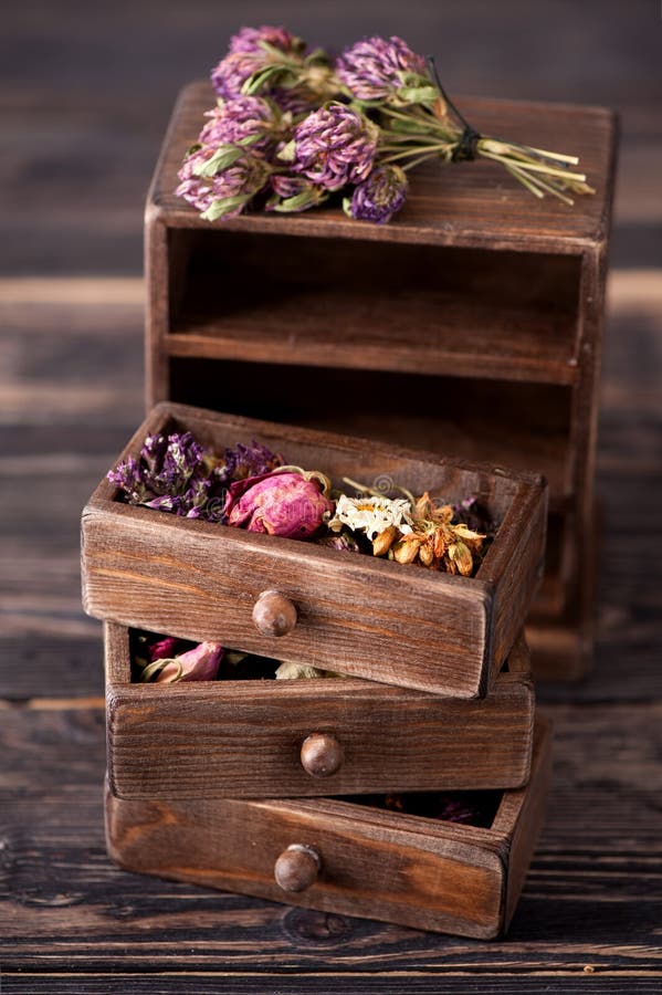 Dried herbs in wooden box stock image. Image of chamomilla - 51890289