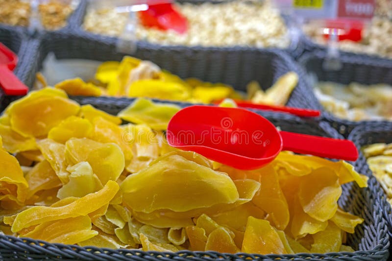 Dried Mango Pieces in a Container in a Supermarket. Stock Image - Image ...