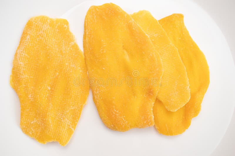 Dried Mango Yellow Slices Close-up on a White Stock Image - Image of ...