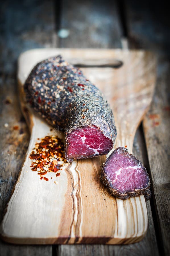 Dried Meat with Pepper and Salt on Rustic Wooden Background Stock Image ...
