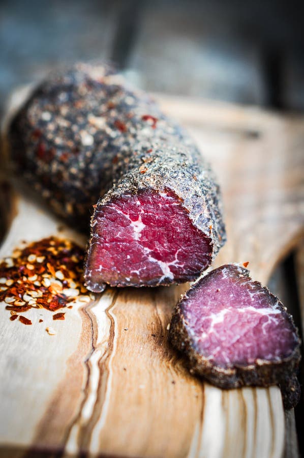 Dried Meat with Pepper and Salt on Rustic Wooden Background Stock Image ...