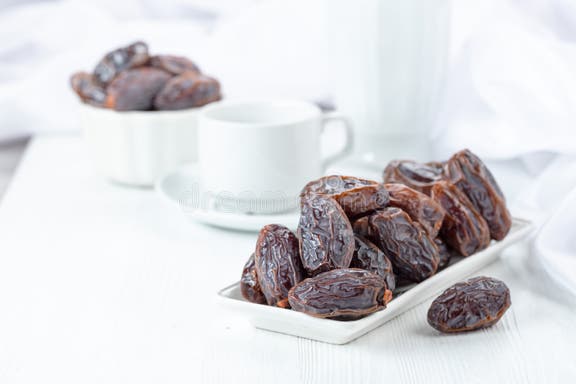 Dried Medjool Dates on a White Table Stock Image - Image of sweet ...