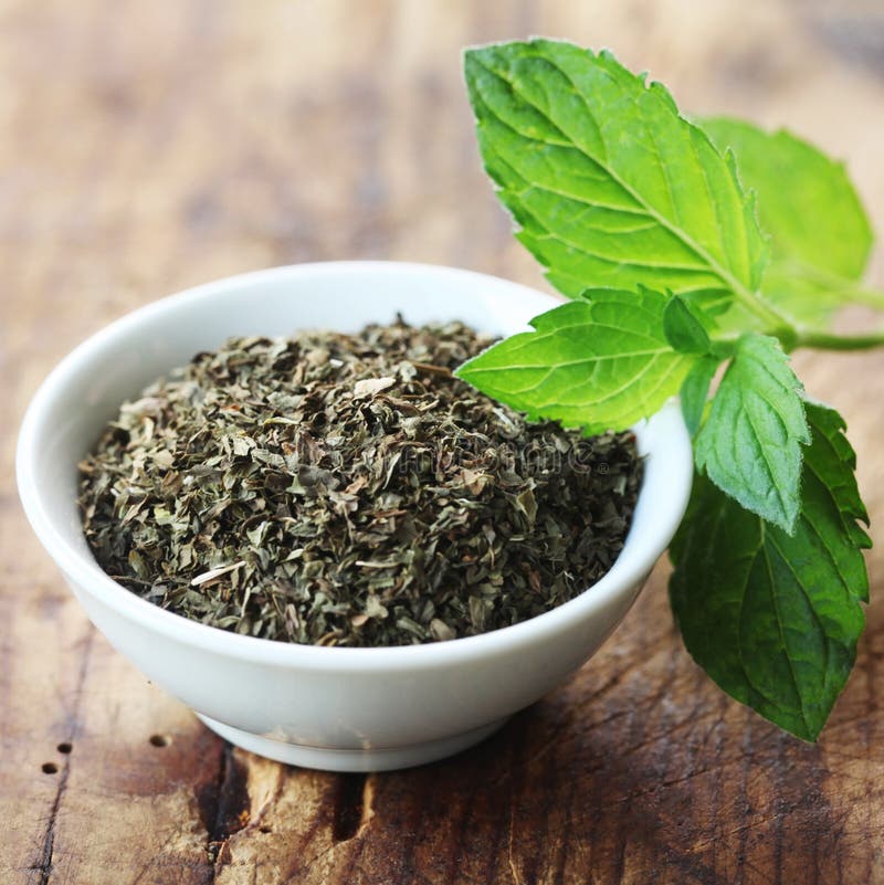 Dried Mint Powder And Natural Green Leaves Of This Plant In Wooden ...