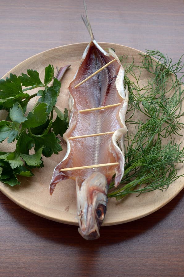 Dried Omul on the Wooden Plate, Decorated with Verdure Stock Image ...
