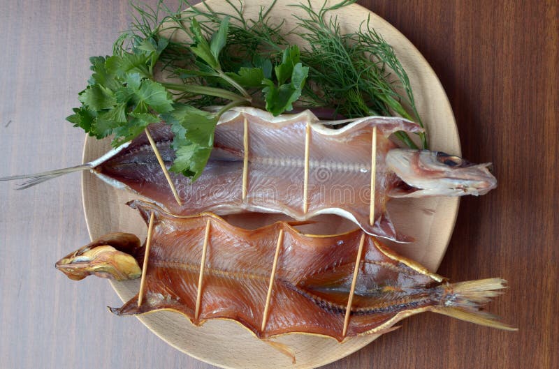 Dried Omul on the Wooden Plate, Decorated with Verdure Stock Image ...