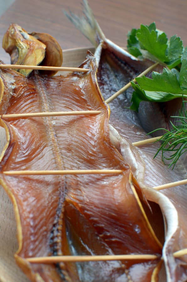 Dried Omul on the Wooden Plate, Decorated with Verdure Stock Photo ...