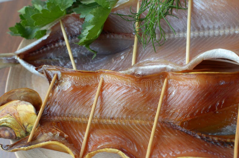 Dried Omul on the Wooden Plate, Decorated with Verdure Stock Image ...