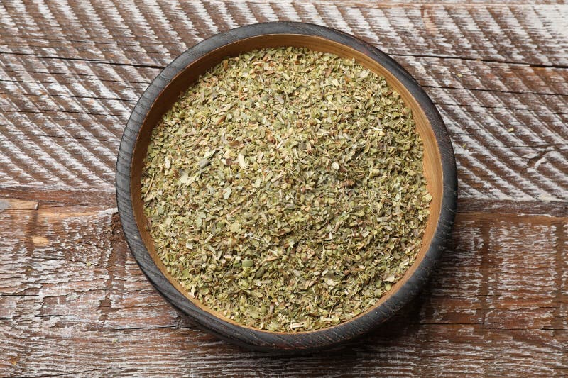 Dried Oregano in Bowl on Wooden Table, Top View Stock Image - Image of ...