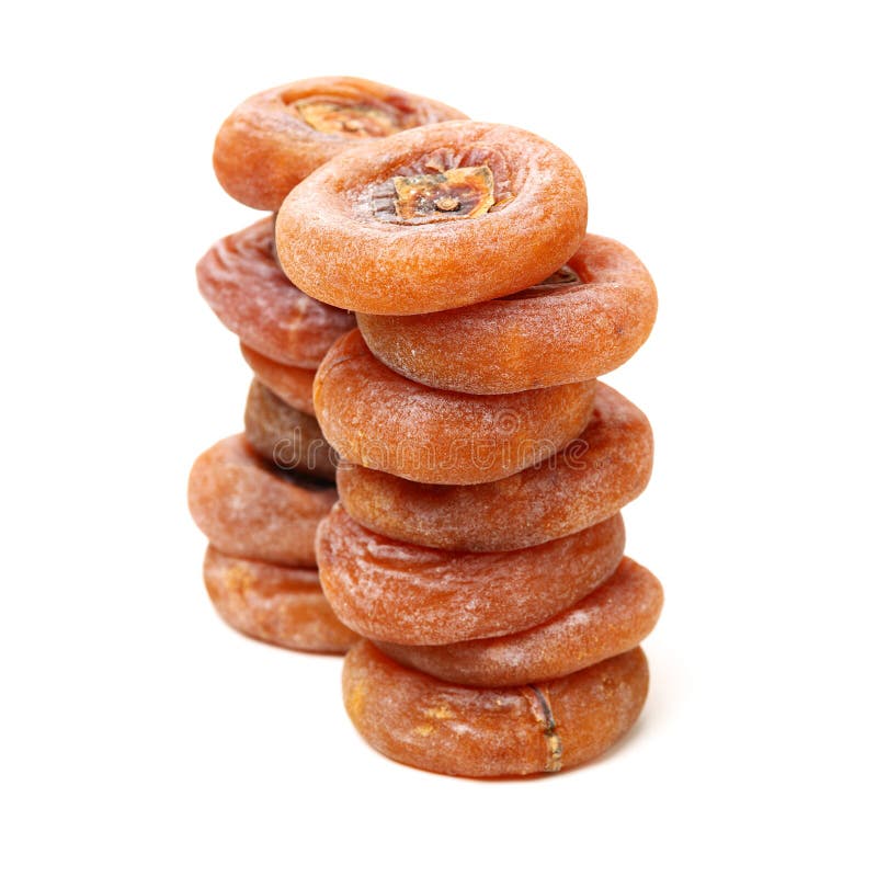 Dried Persimmon with Powdered Sugar Lies on a Stone Dish, on a Dark ...