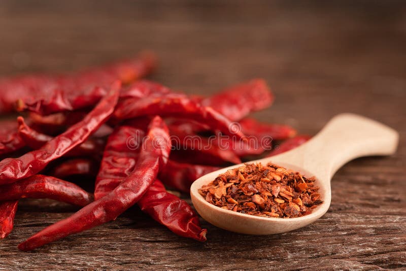 Dried Red Chili on Wooden Table.Chili Powder on a Wooden Spoon Stock ...