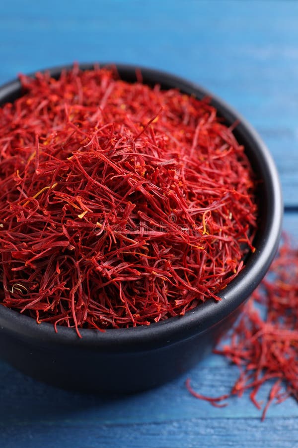 Dried Saffron on Blue Wooden Table, Closeup Stock Photo - Image of ...